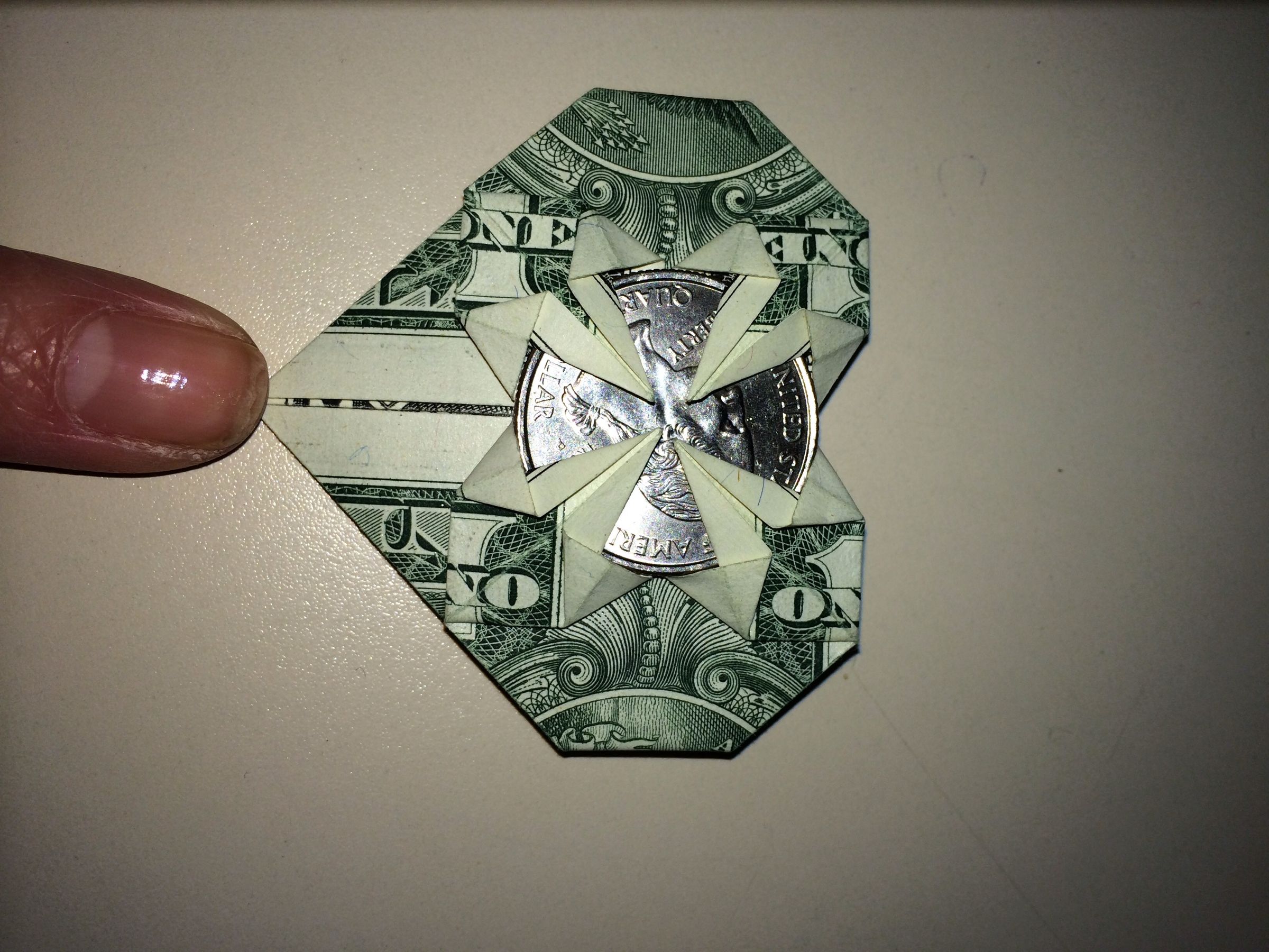 Dollar Origami Heart Holding Quarter : 11 Steps - Instructables
