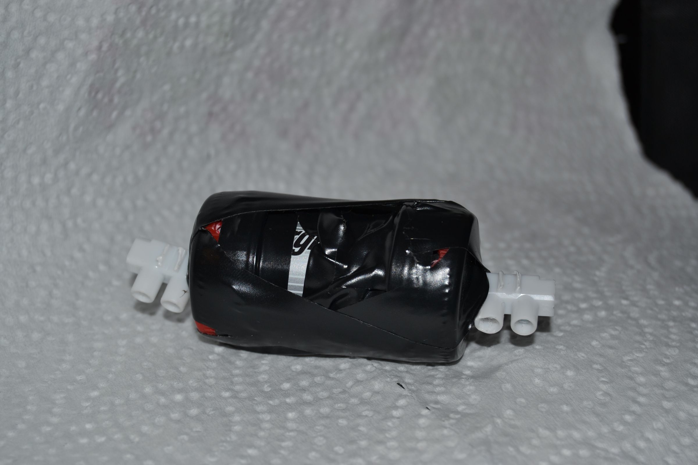 Make a Battery Cell Holder Out of 2 Soda Bottle Caps - Instructables
