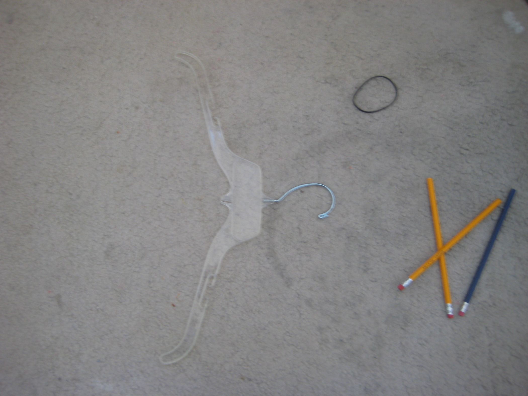 How to Make a Quick, Powerful and Cheap Bow From a Plastic Hanger : 3 ...