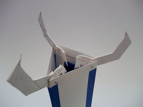Claws Ripping Through Paper
