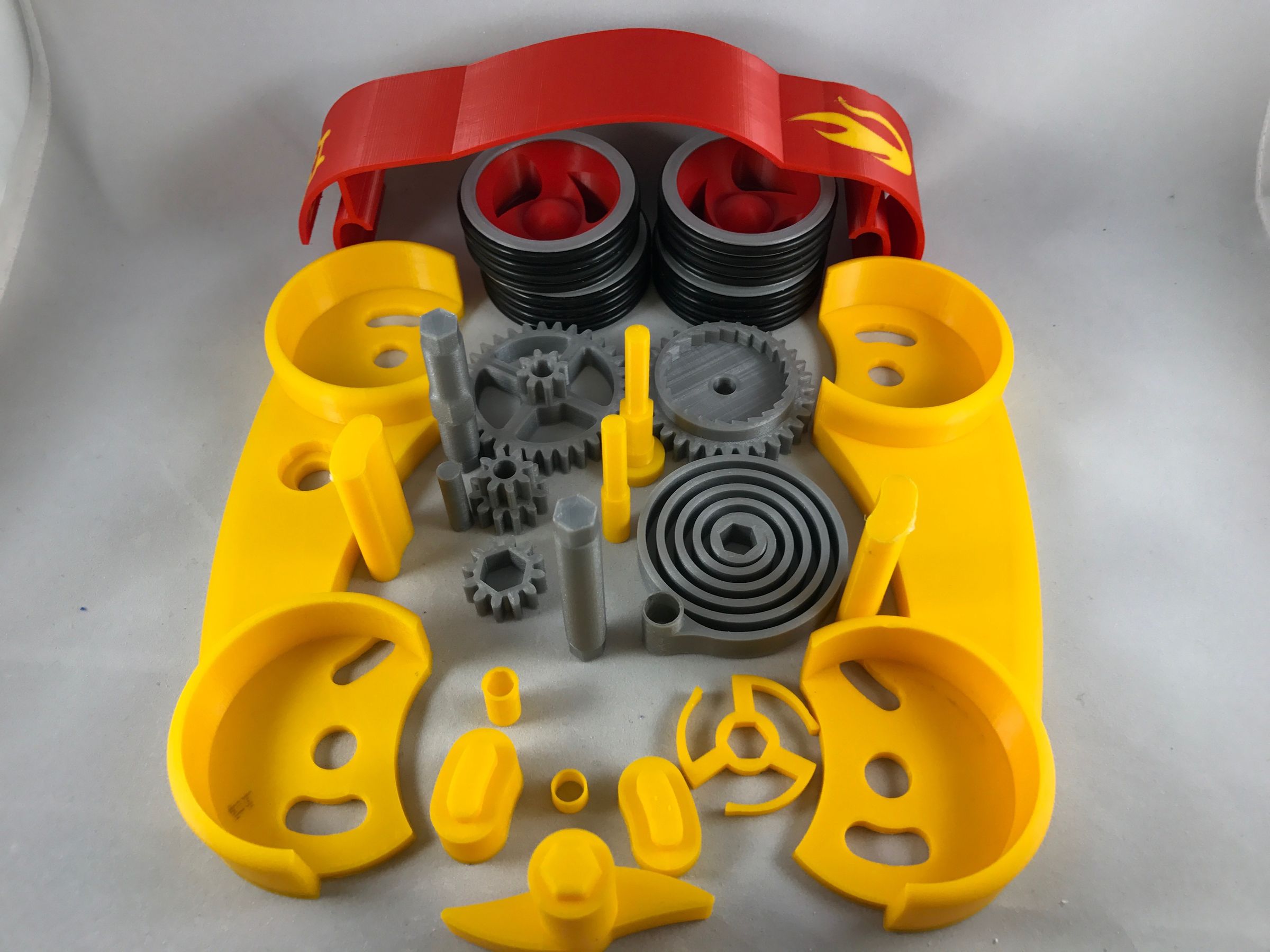 Off-white plastic cogwheel with 2 arms extracted from 4-year old's ...