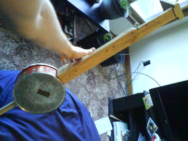 A Cookie-tin Banjo in 14 Steps or Less : 14 Steps - Instructables