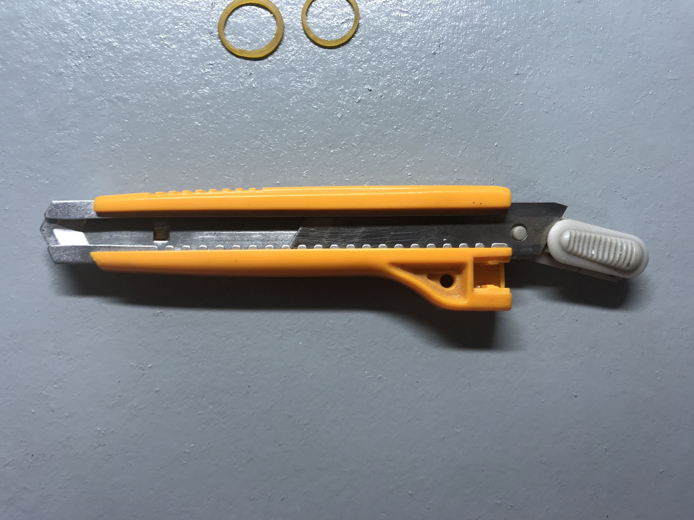 Self Retracting Box Cutter Using Rubber Band : 4 Steps - Instructables