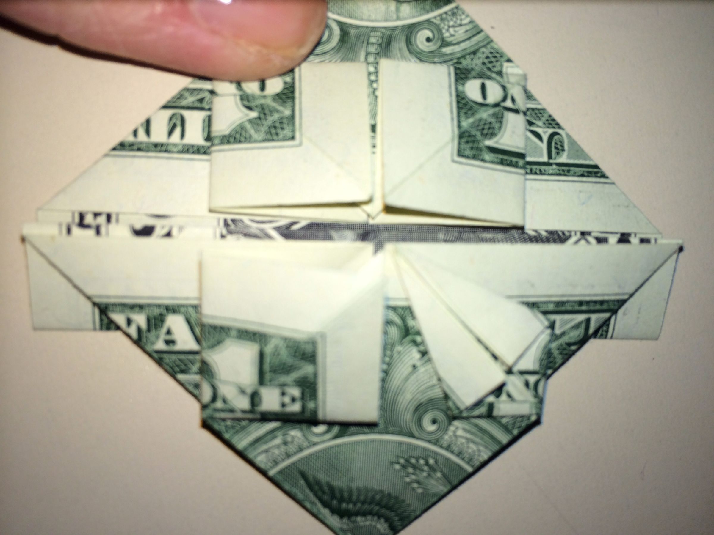 Dollar Origami Heart Holding Quarter : 11 Steps - Instructables