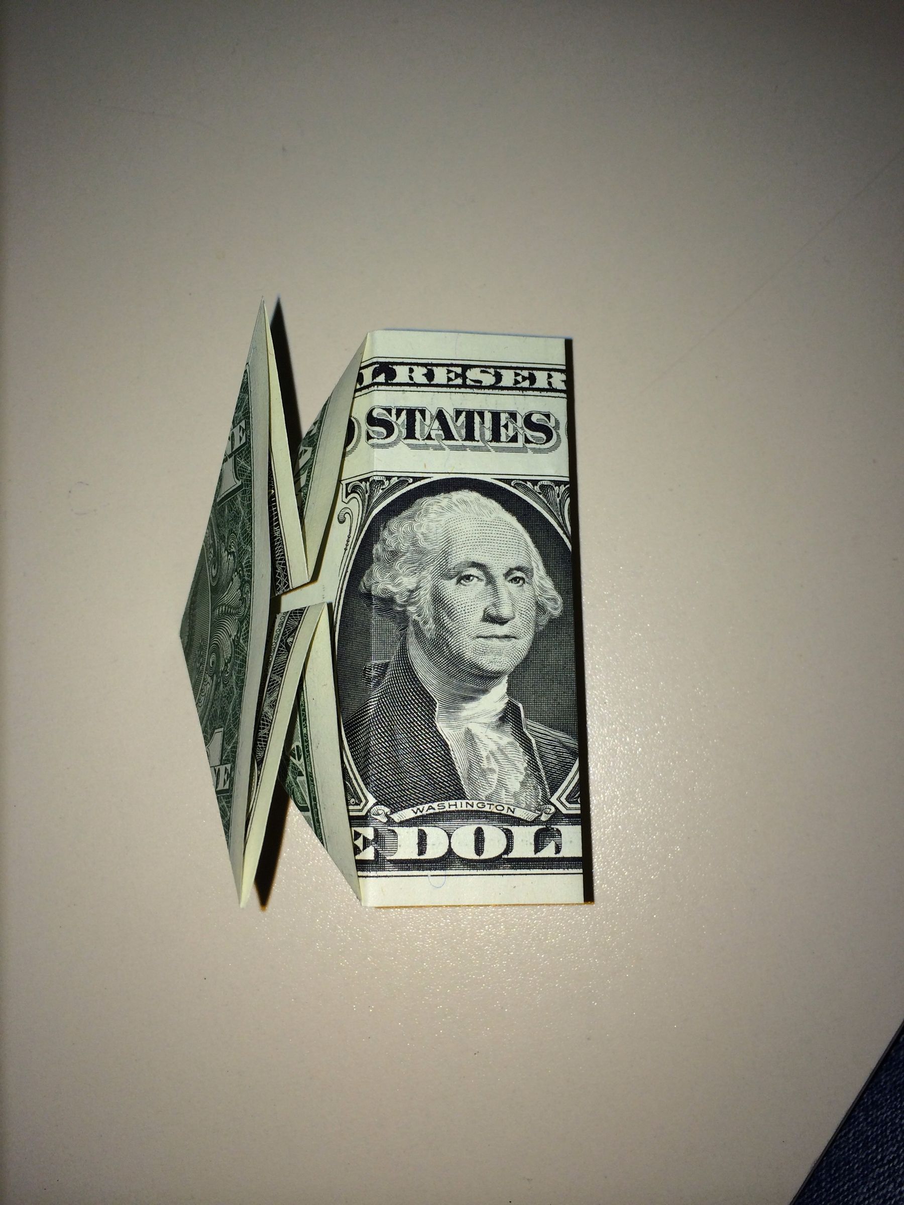 Dollar Origami Heart Holding Quarter : 11 Steps - Instructables