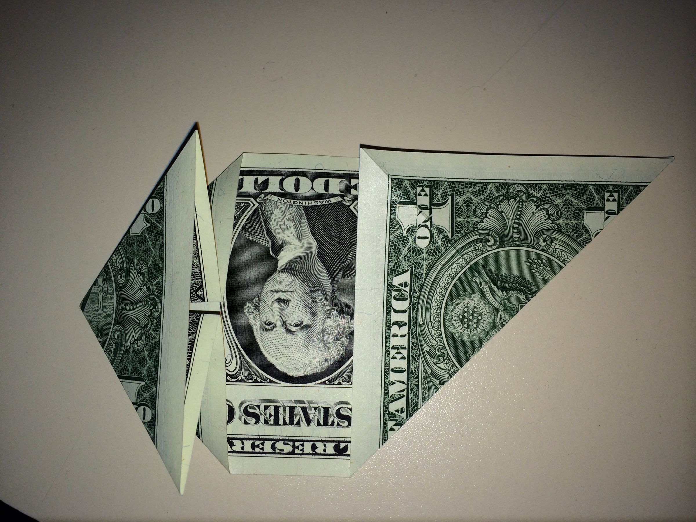 Dollar Origami Heart Holding Quarter : 11 Steps - Instructables