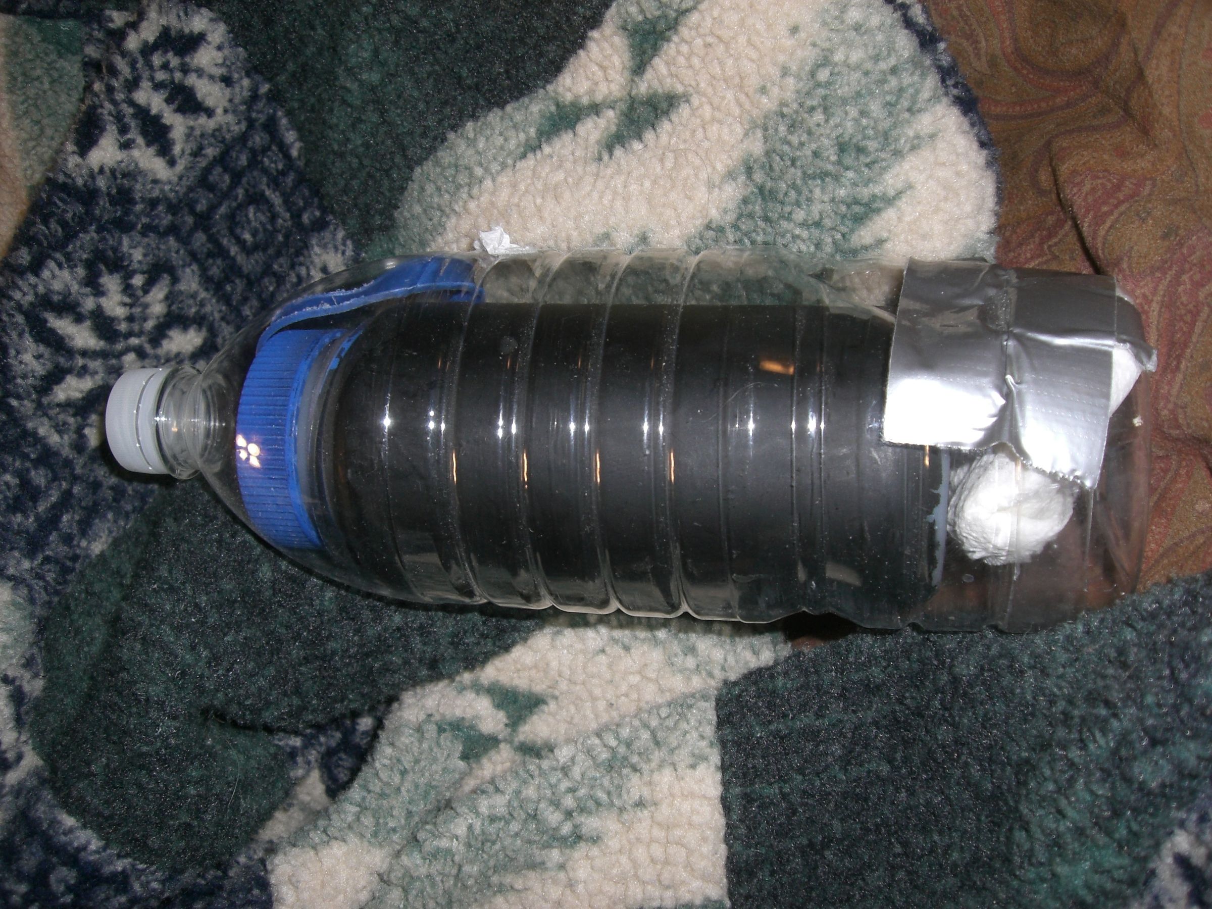Solar Water Heater for Backpacking Using Water Bottles and a Car Shade ...