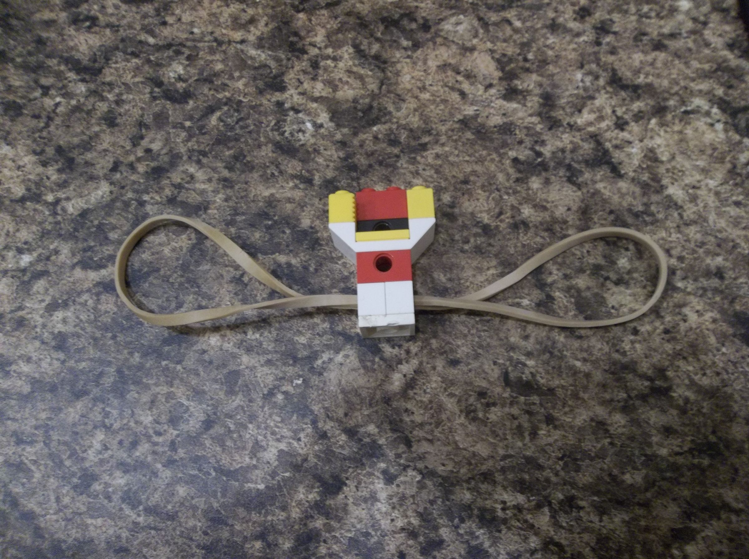Rubber Band Lego Guy Vertical Catapult (FAST) : 10 Steps - Instructables