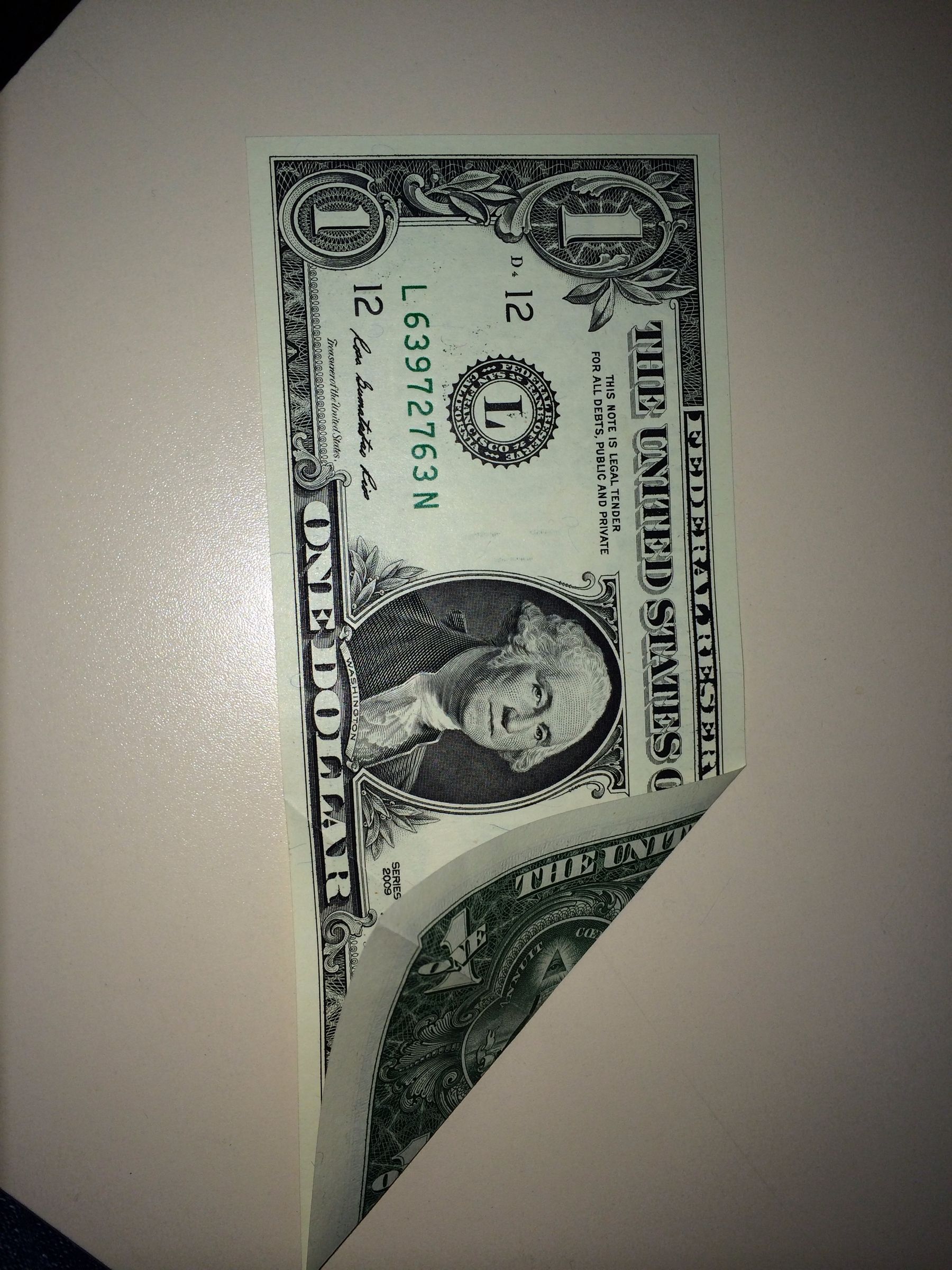 Dollar Origami Heart Holding Quarter : 11 Steps - Instructables