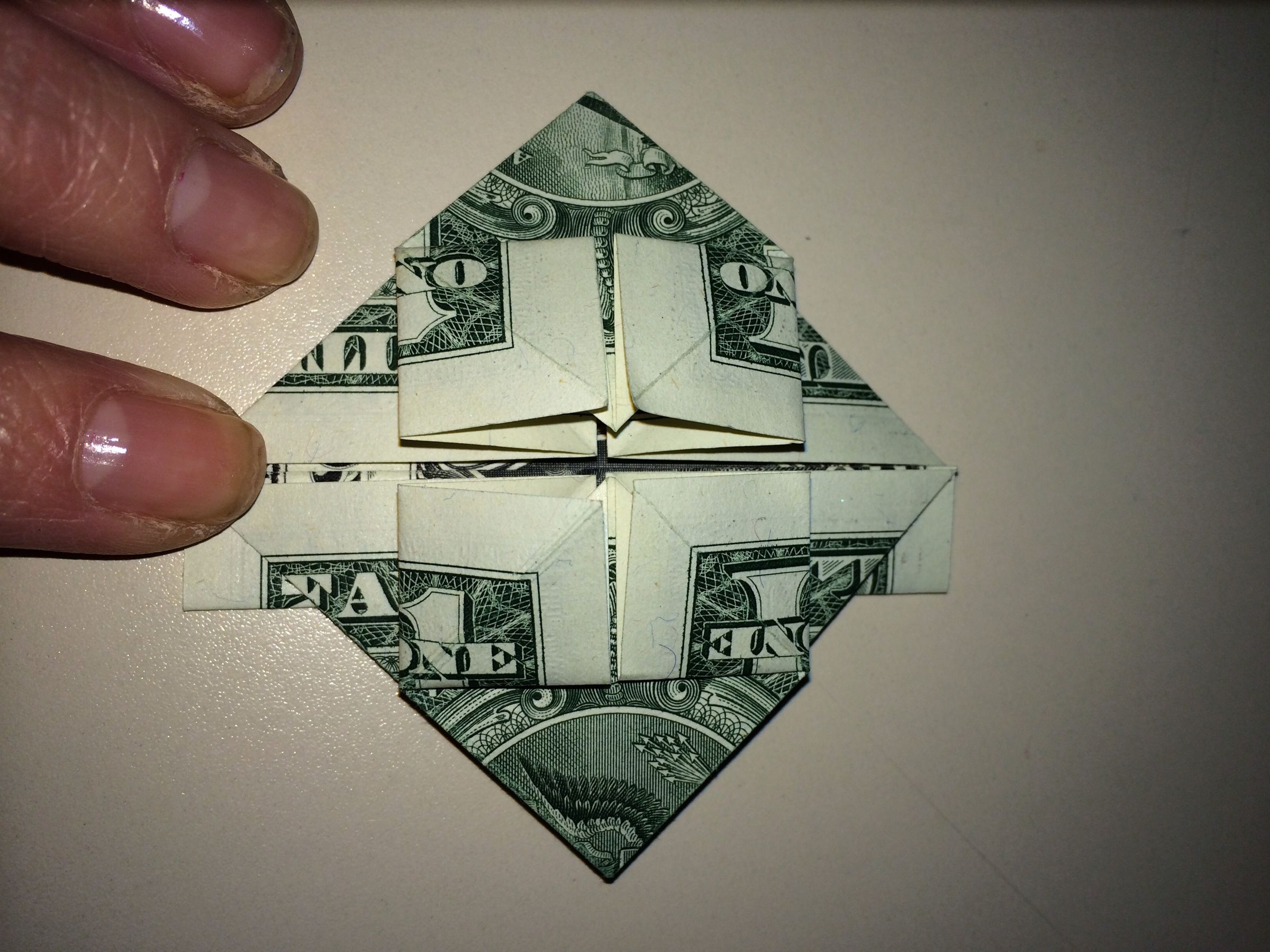 Dollar Origami Heart Holding Quarter : 11 Steps - Instructables