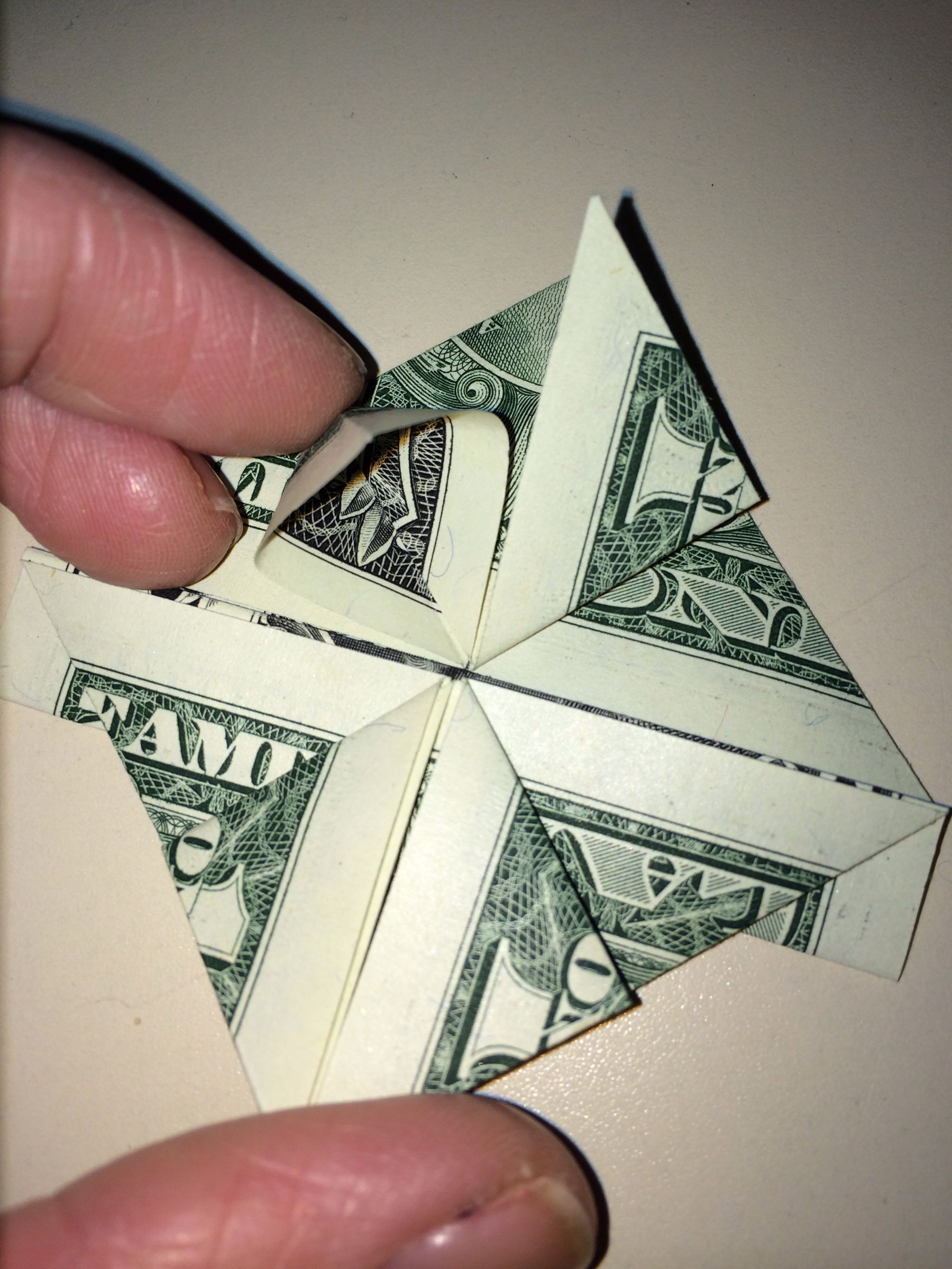 Dollar Origami Heart Holding Quarter : 11 Steps - Instructables