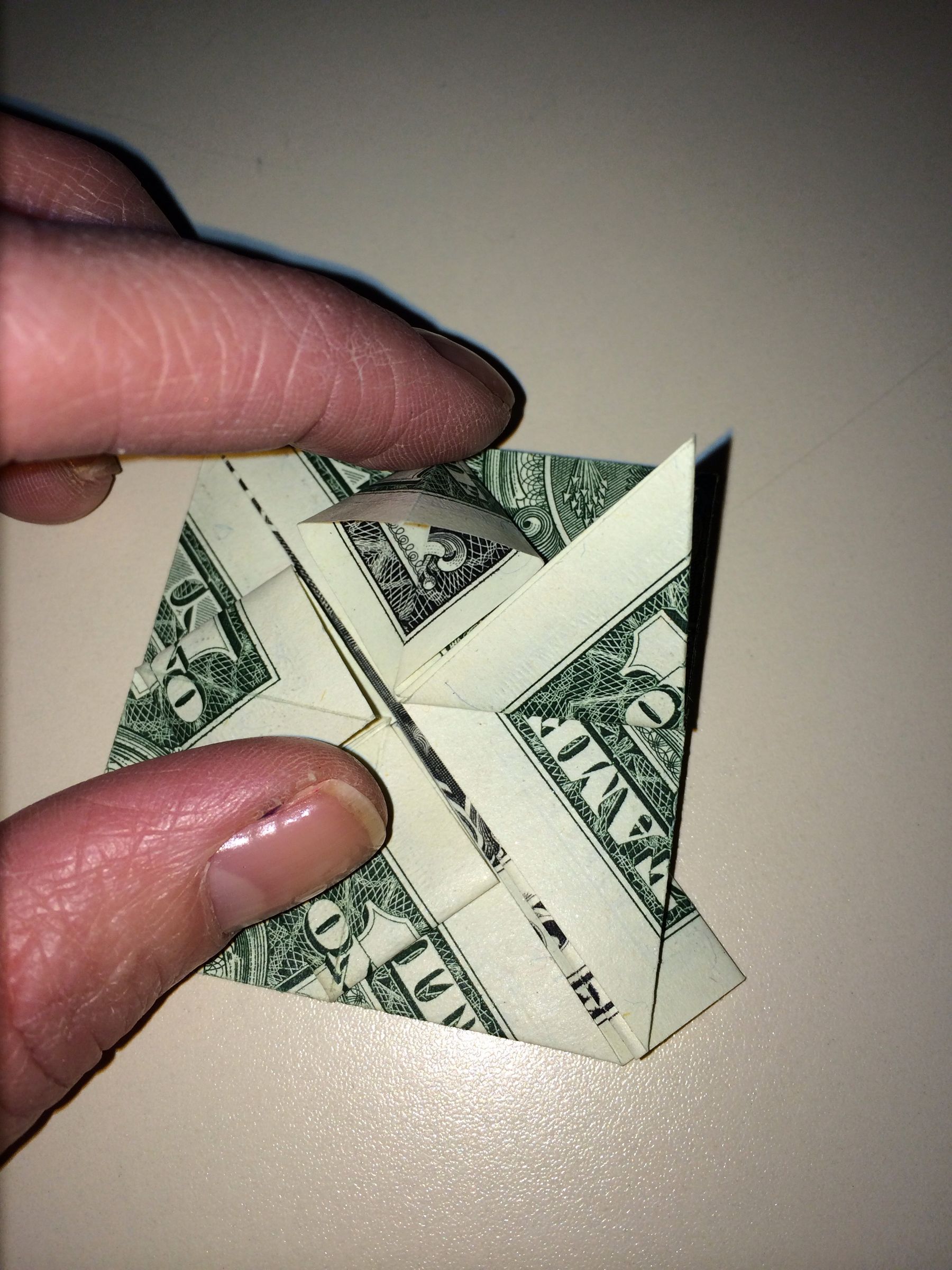 Dollar Origami Heart Holding Quarter : 11 Steps - Instructables