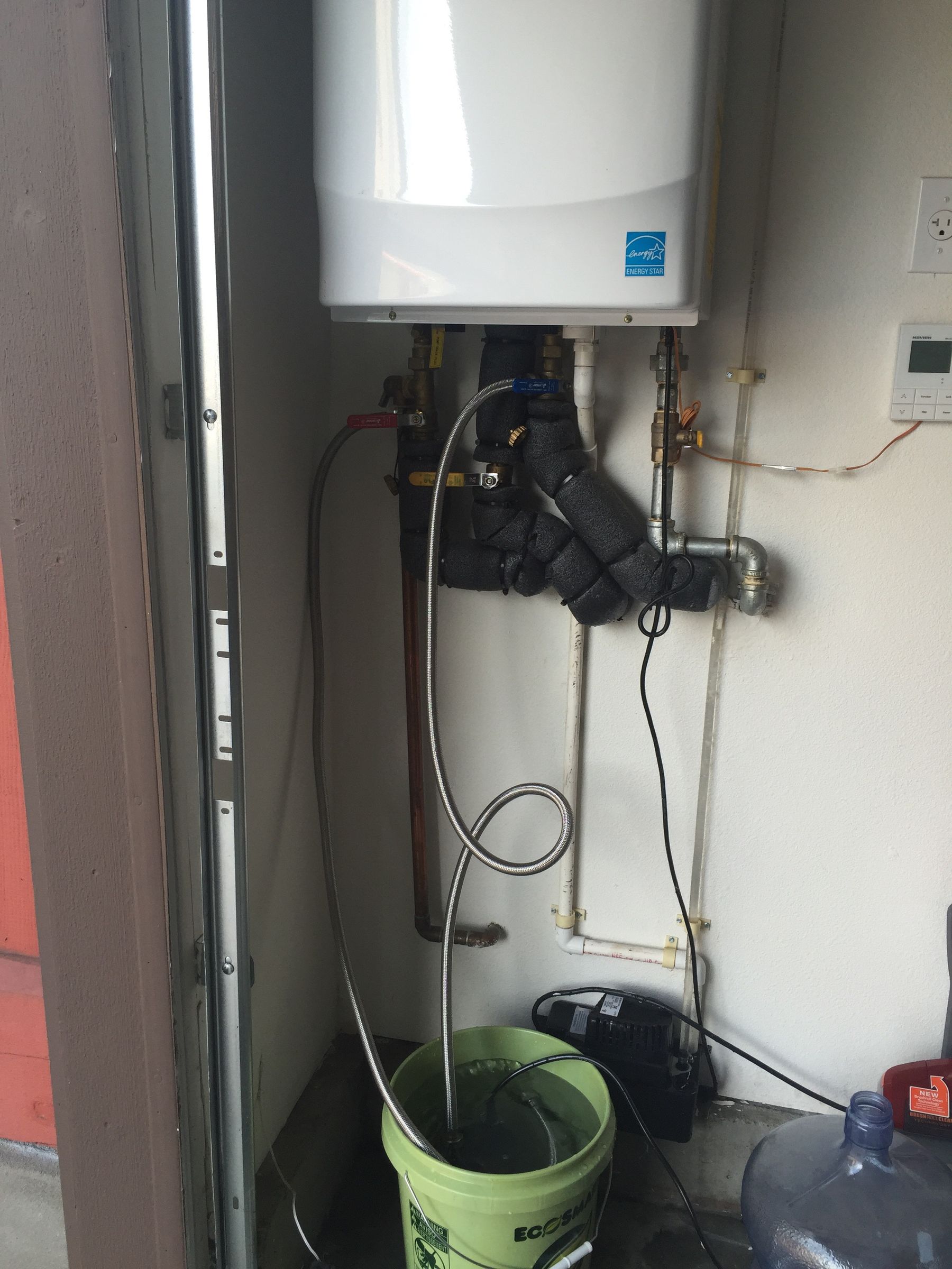 How to Flush a Tankless Water Heater and Clean the Air Intake Filter ...